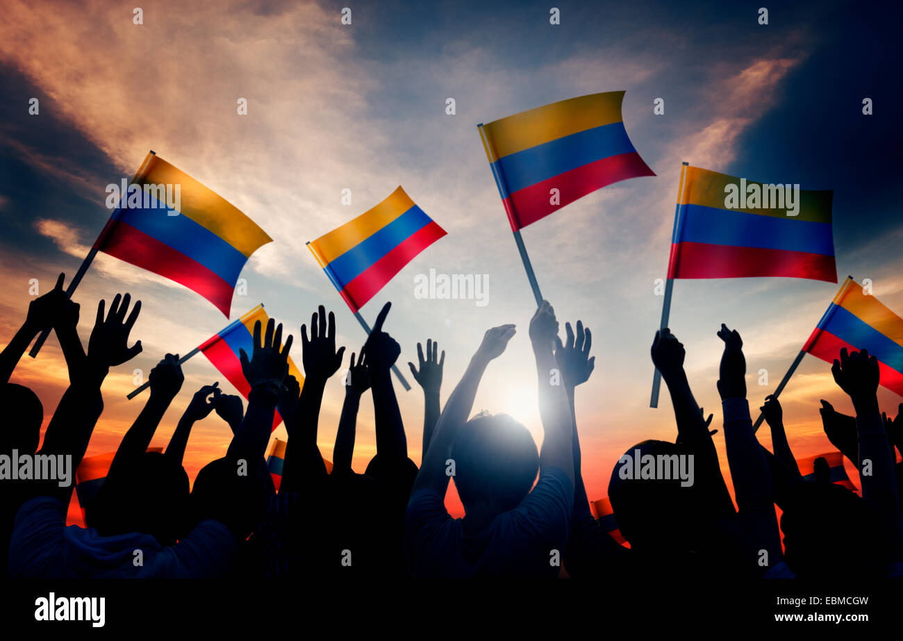 Silhouettes of People Holding Flag of Colombia Stock Photo - Alamy