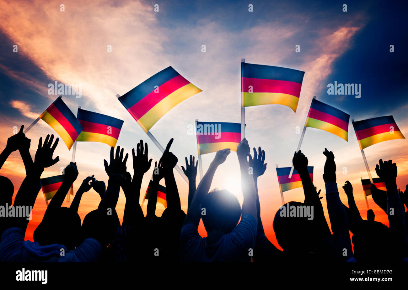 Silhouettes of People Holding Flag of Germany Stock Photo - Alamy