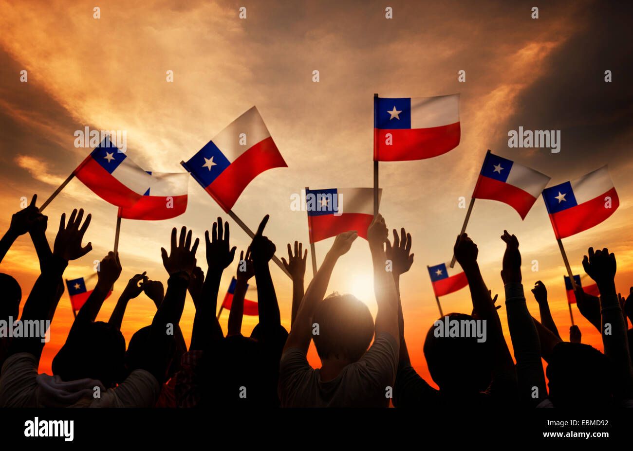 Silhouettes of People Holding Flag of Chile Stock Photo - Alamy