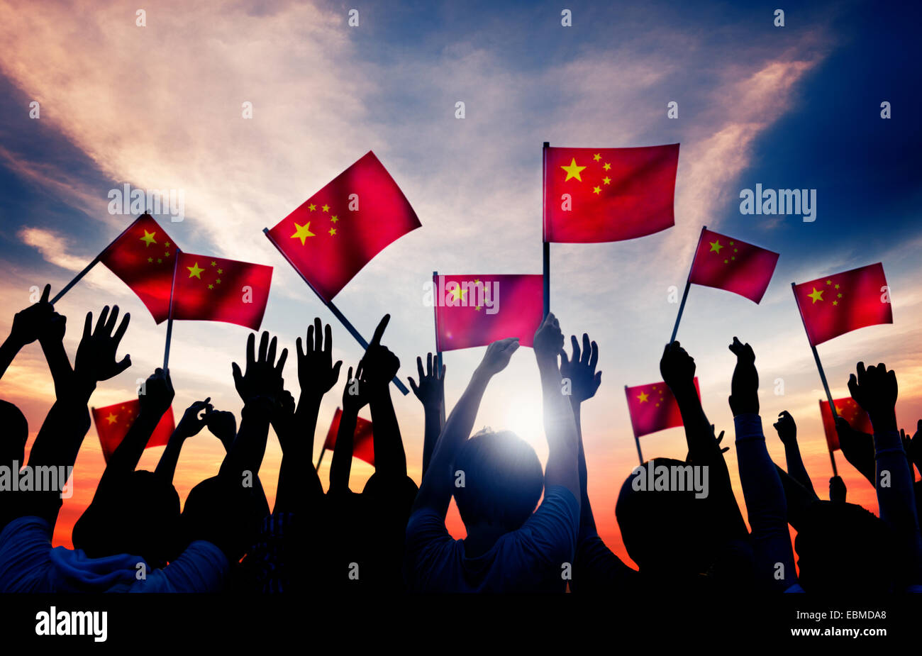 Silhouettes of People Holding the Flag of China Stock Photo - Alamy