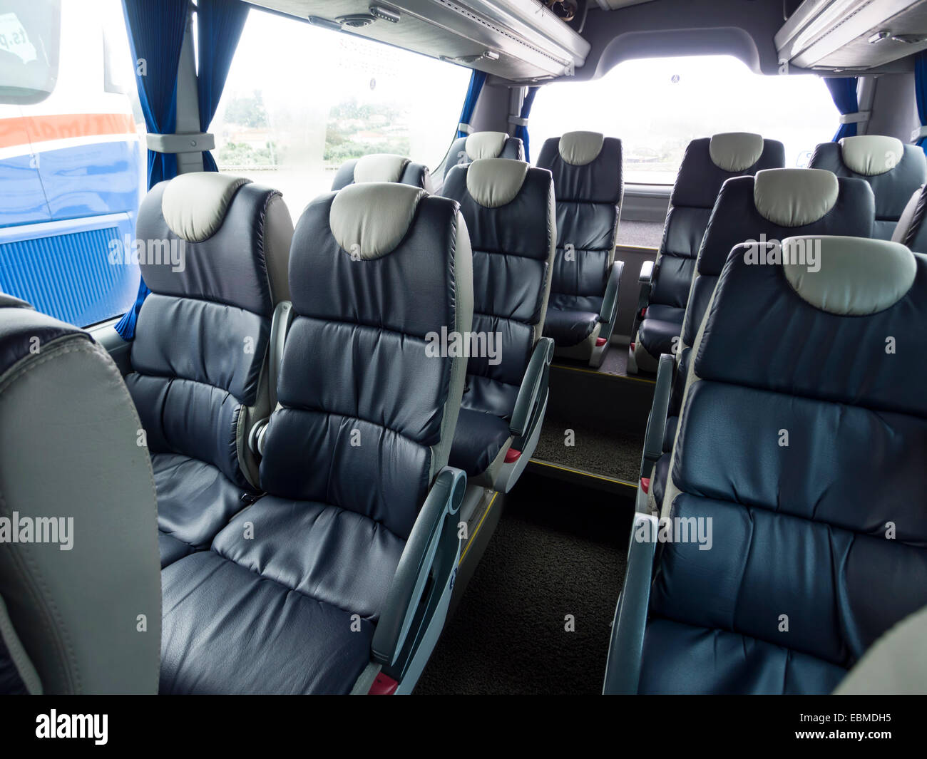 Rows of leather seats inside a luxurious minibus Stock Photo - Alamy