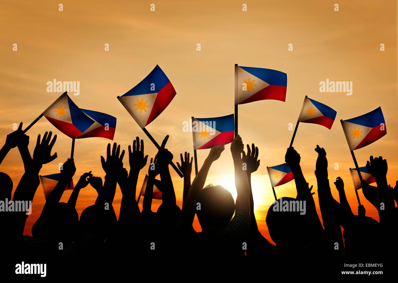 Group of People Waving Filipino Flags in Back Lit Stock Photo - Alamy