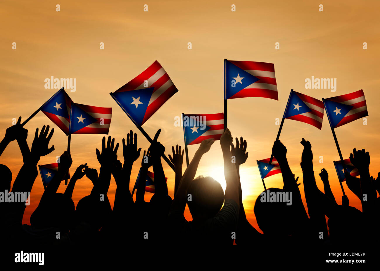 Group of People Waving Flag of Puerto Rico in Back Lit Stock Photo - Alamy