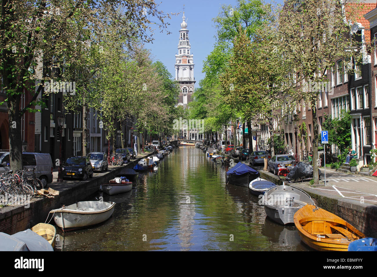 Small boats along Groenburgwal canal, Zuiderkerk church at back ...