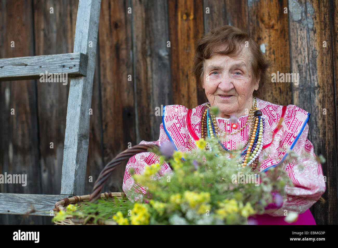 Old woman outdoors in the countryside Stock Photo - Alamy