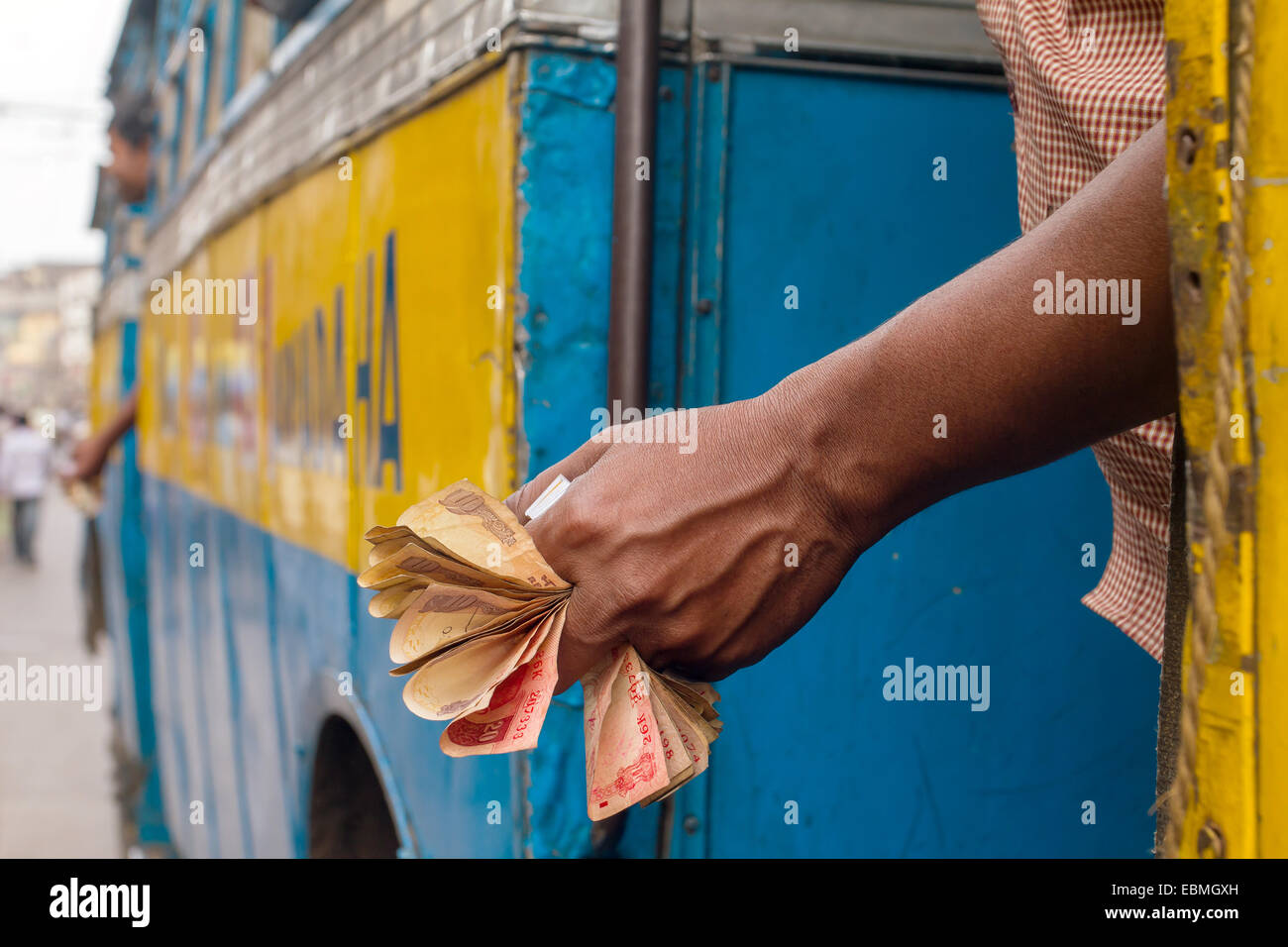 Man holding Indian rupee notes Stock Photo - Alamy