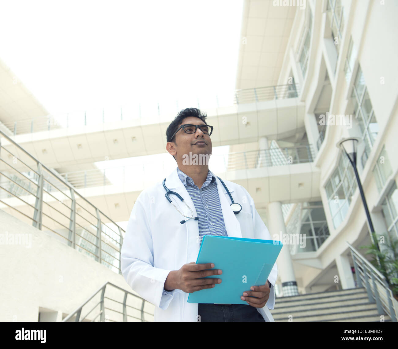 Doctor reading report hi-res stock photography and images - Alamy
