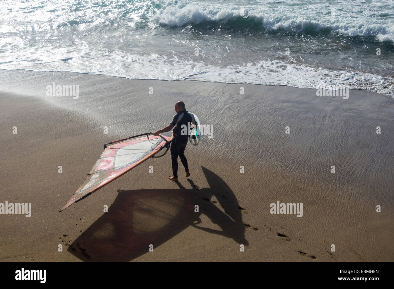 Windsurfer on beach Stock Photo - Alamy