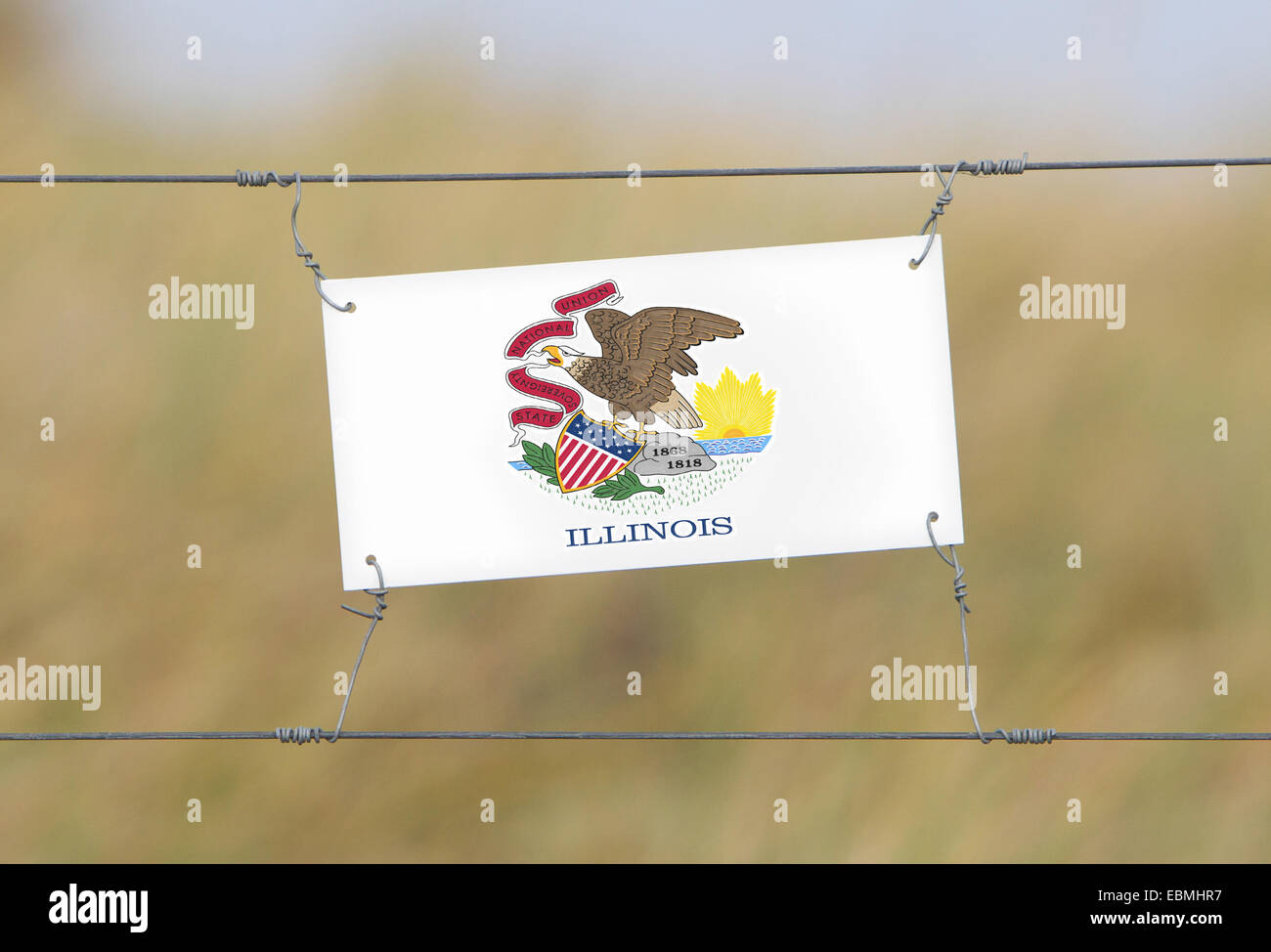 Border fence - Old plastic sign with a flag - Illinois Stock Photo - Alamy