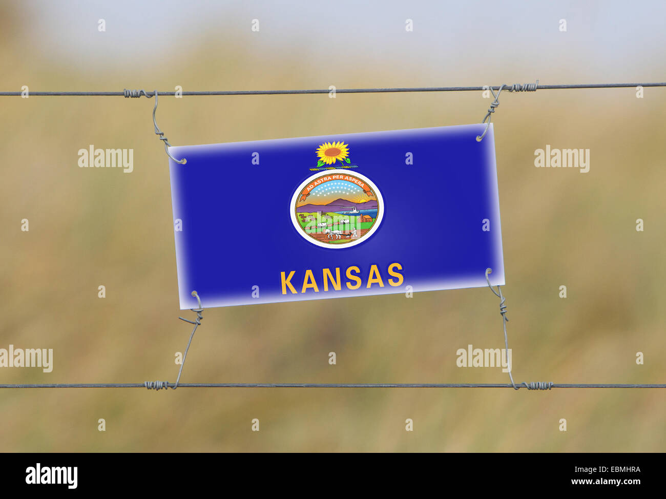 Border fence - Old plastic sign with a flag - Kansas Stock Photo - Alamy
