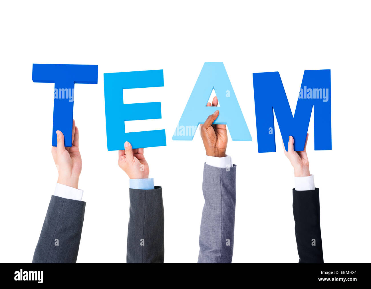 Business People Arms Raised and Holding the Word Team Stock Photo - Alamy