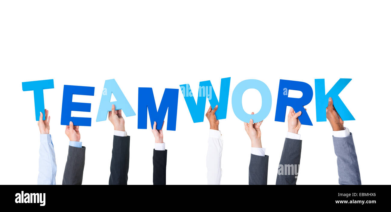 Business People Arms Raised and Holding the Word Teamwork Stock Photo ...