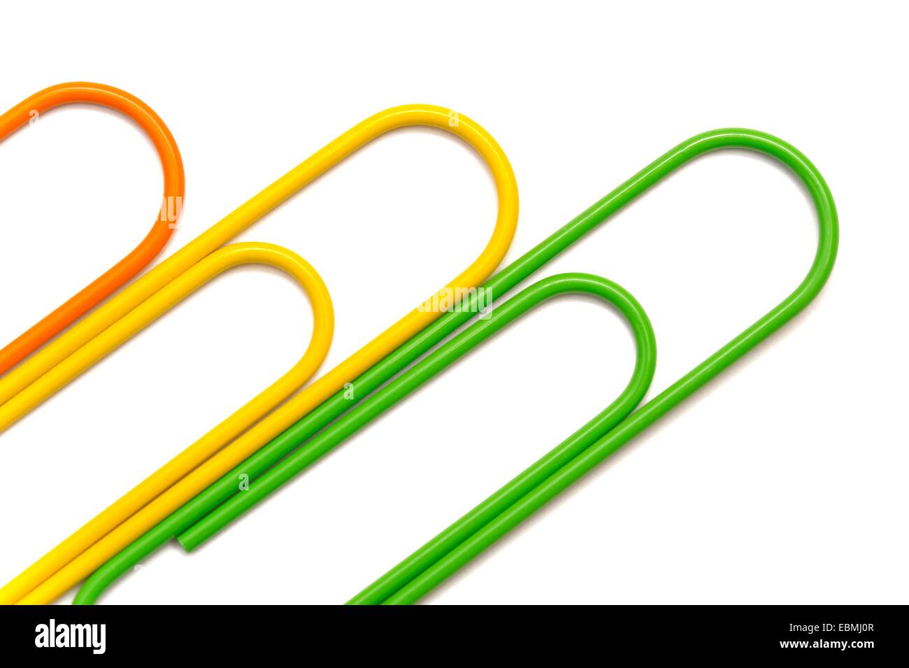 Giant paper clips arranged on a white paper background Stock Photo - Alamy