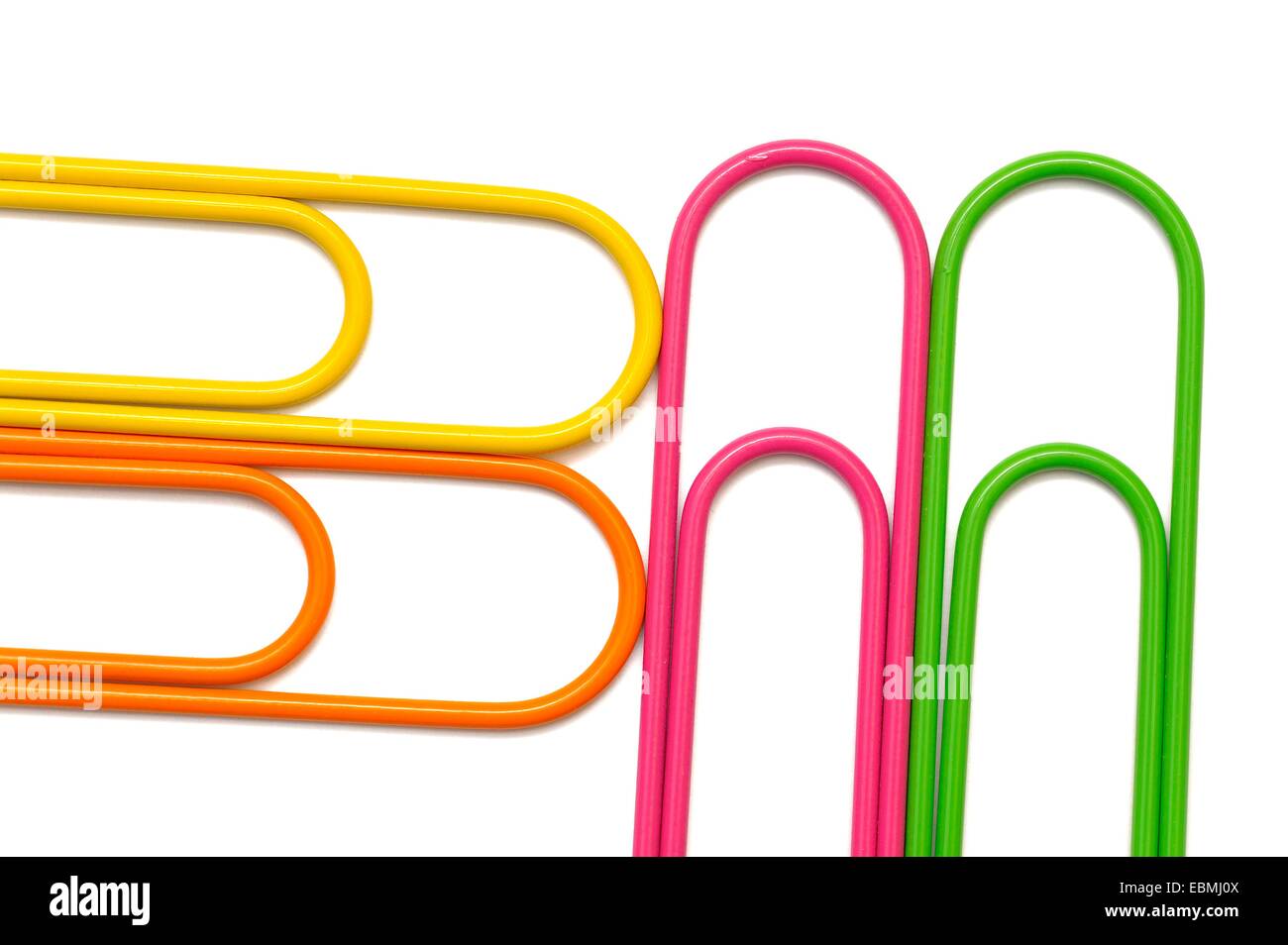 Giant paper clips arranged on a white paper background Stock Photo - Alamy