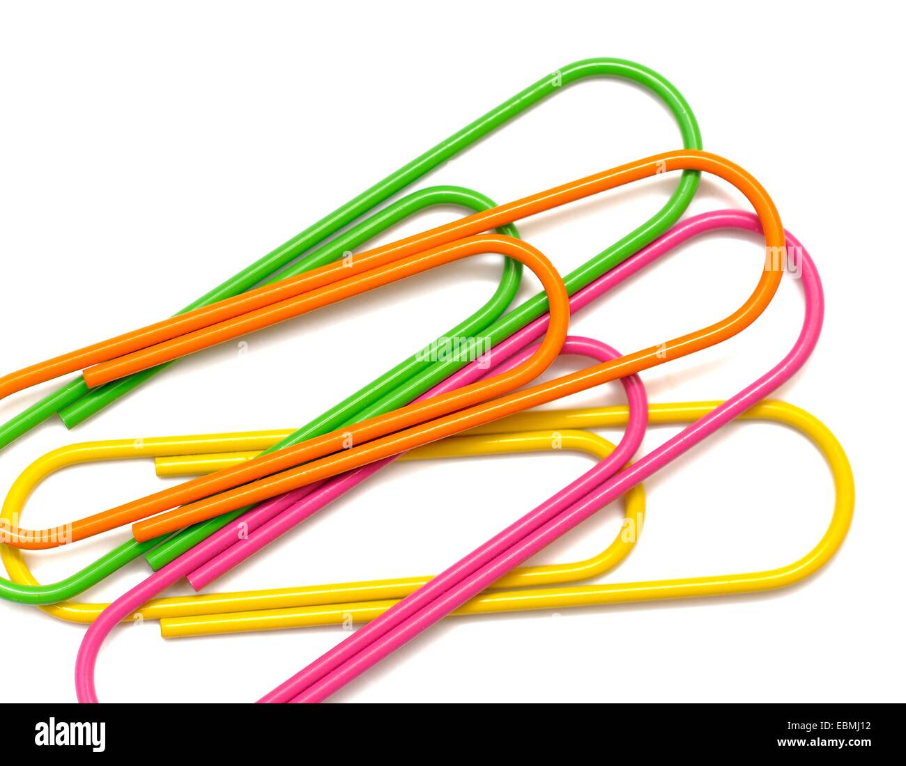 Giant paper clips arranged on a white paper background Stock Photo - Alamy