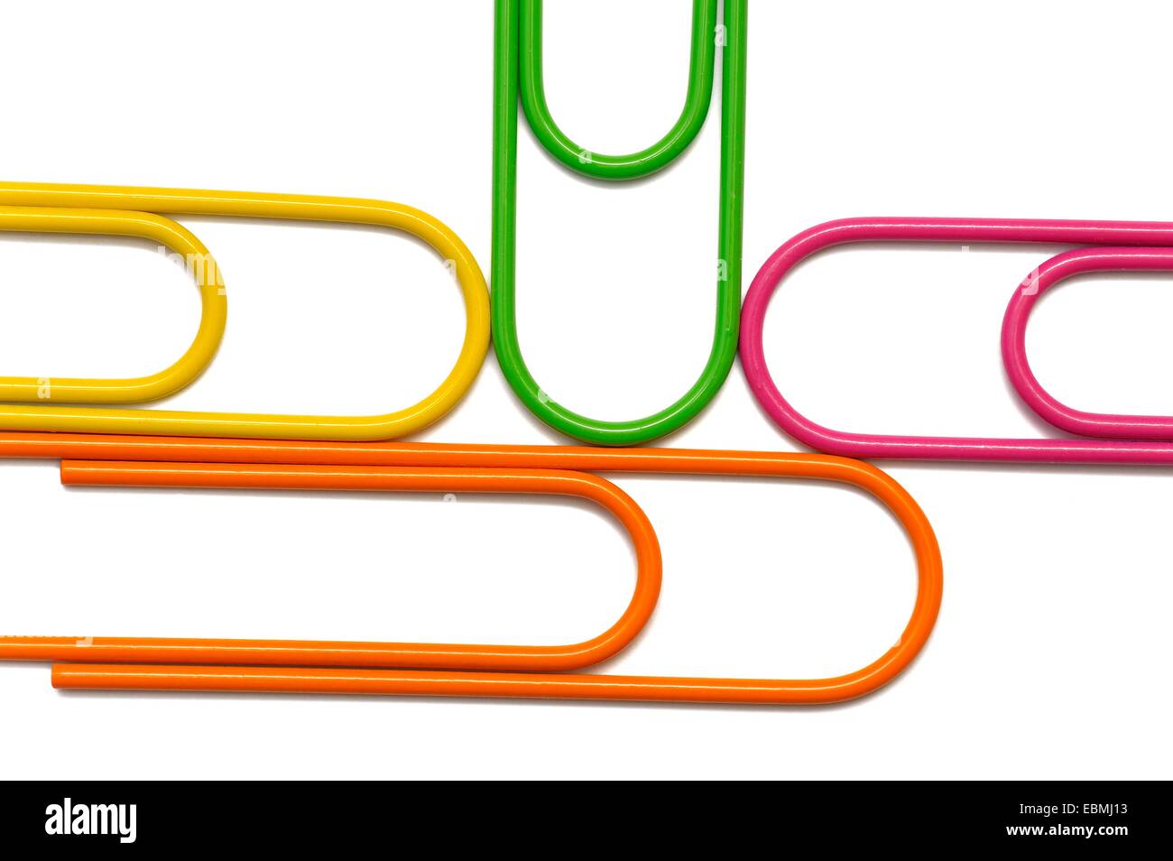 Giant paper clips arranged on a white paper background Stock Photo - Alamy