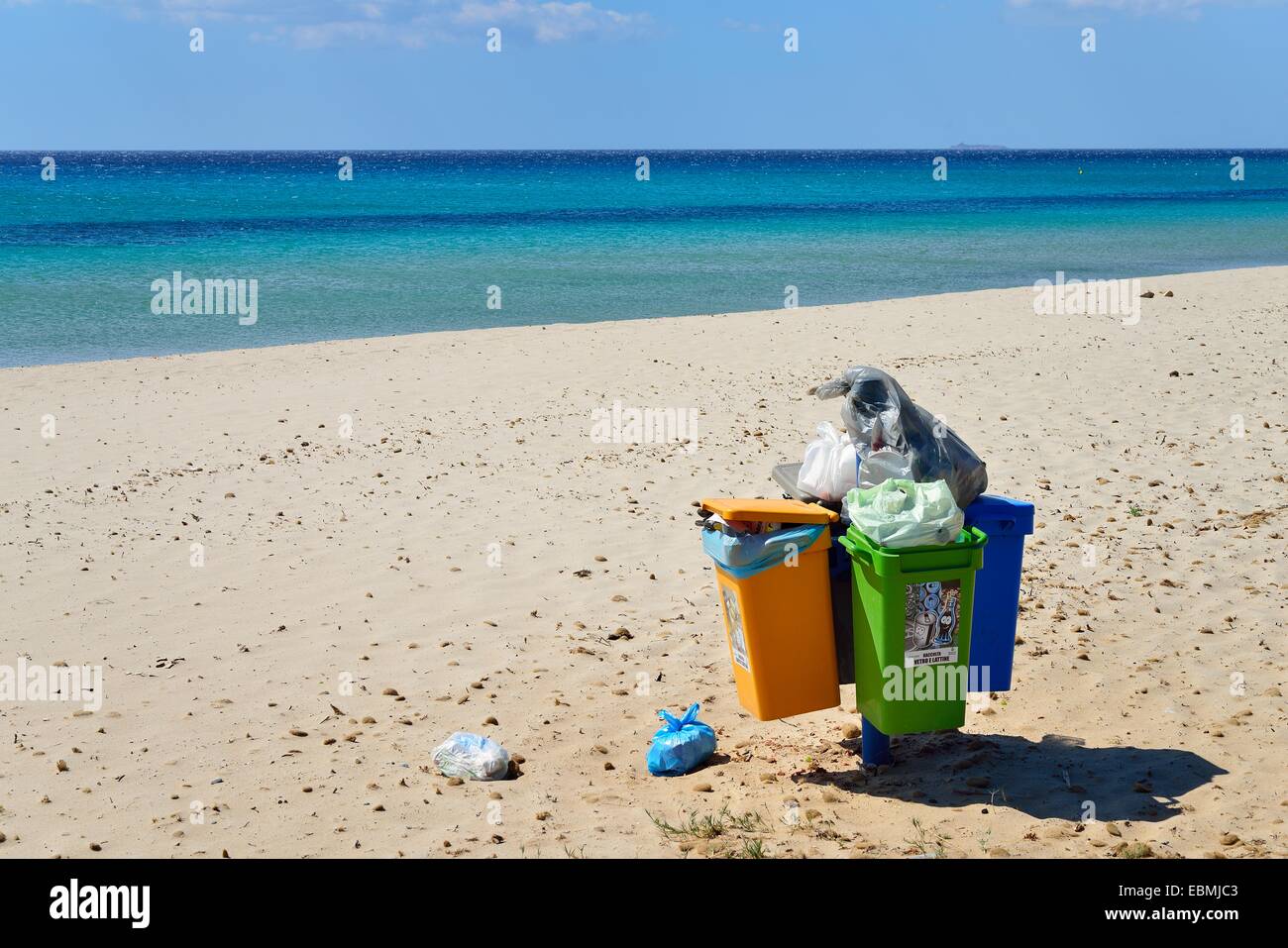 Overflowing trash cans on the beach, Costa Rei, Cagliari, Sardinia ...