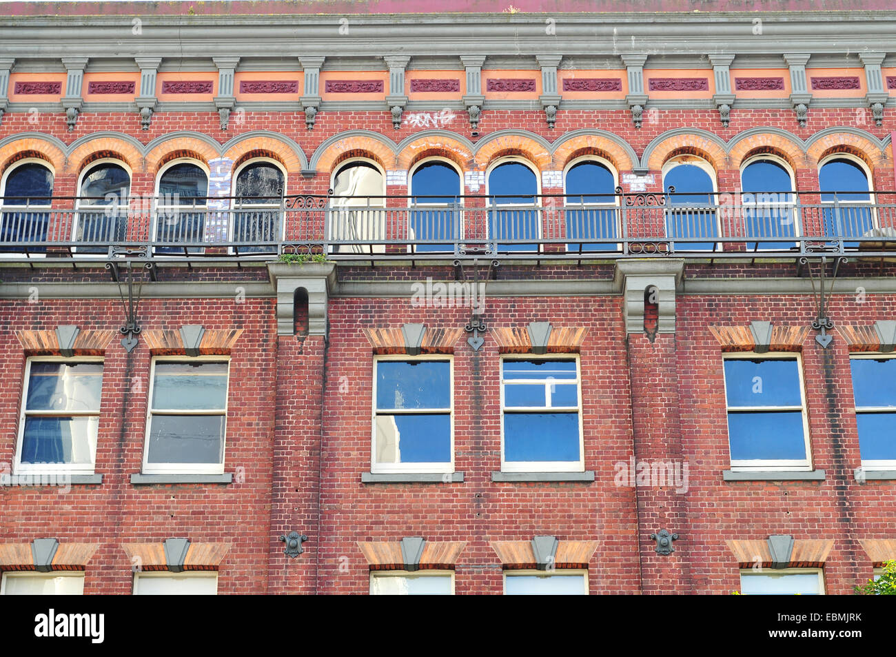 Building facade made of red bricks with first row of rectangular ...