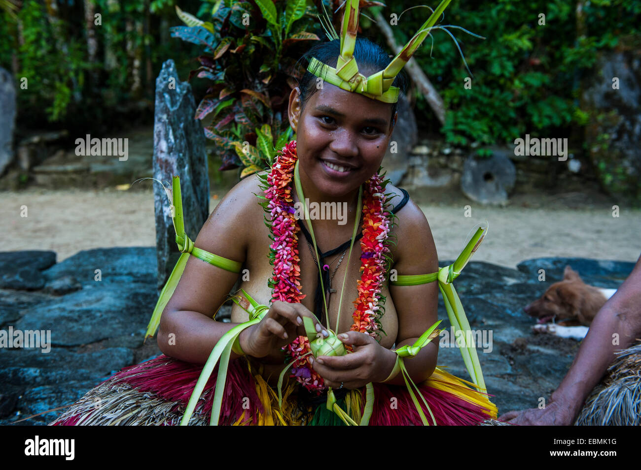 Traditionally dressed islander making traditional art work, Yap Island ...