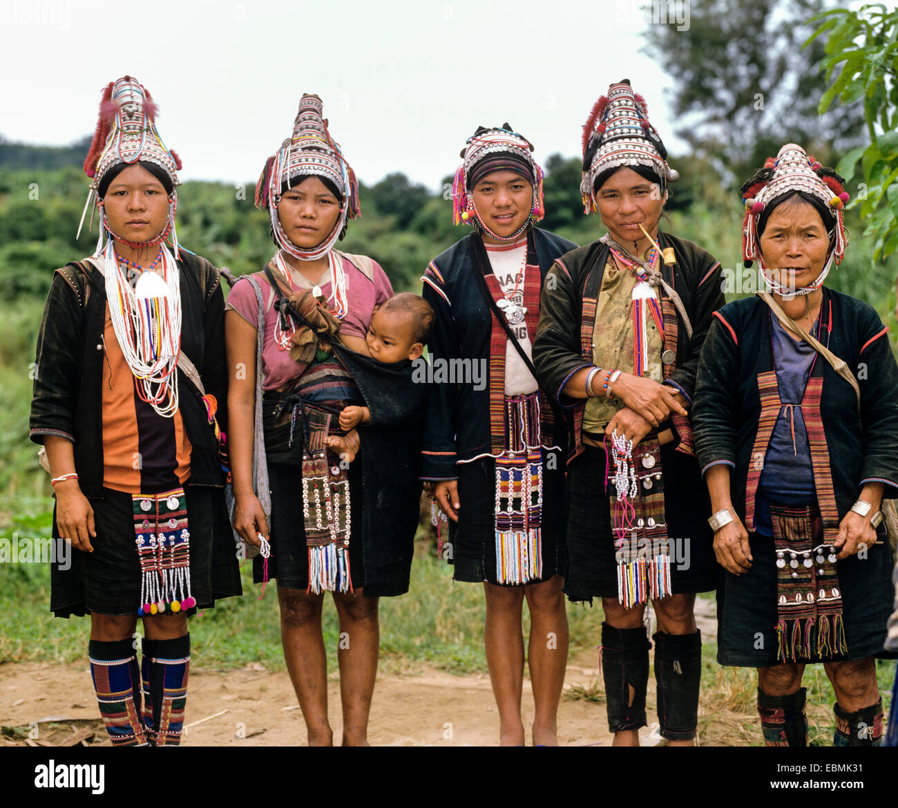 Five Akha women in a mountain village, in traditional costume and ...