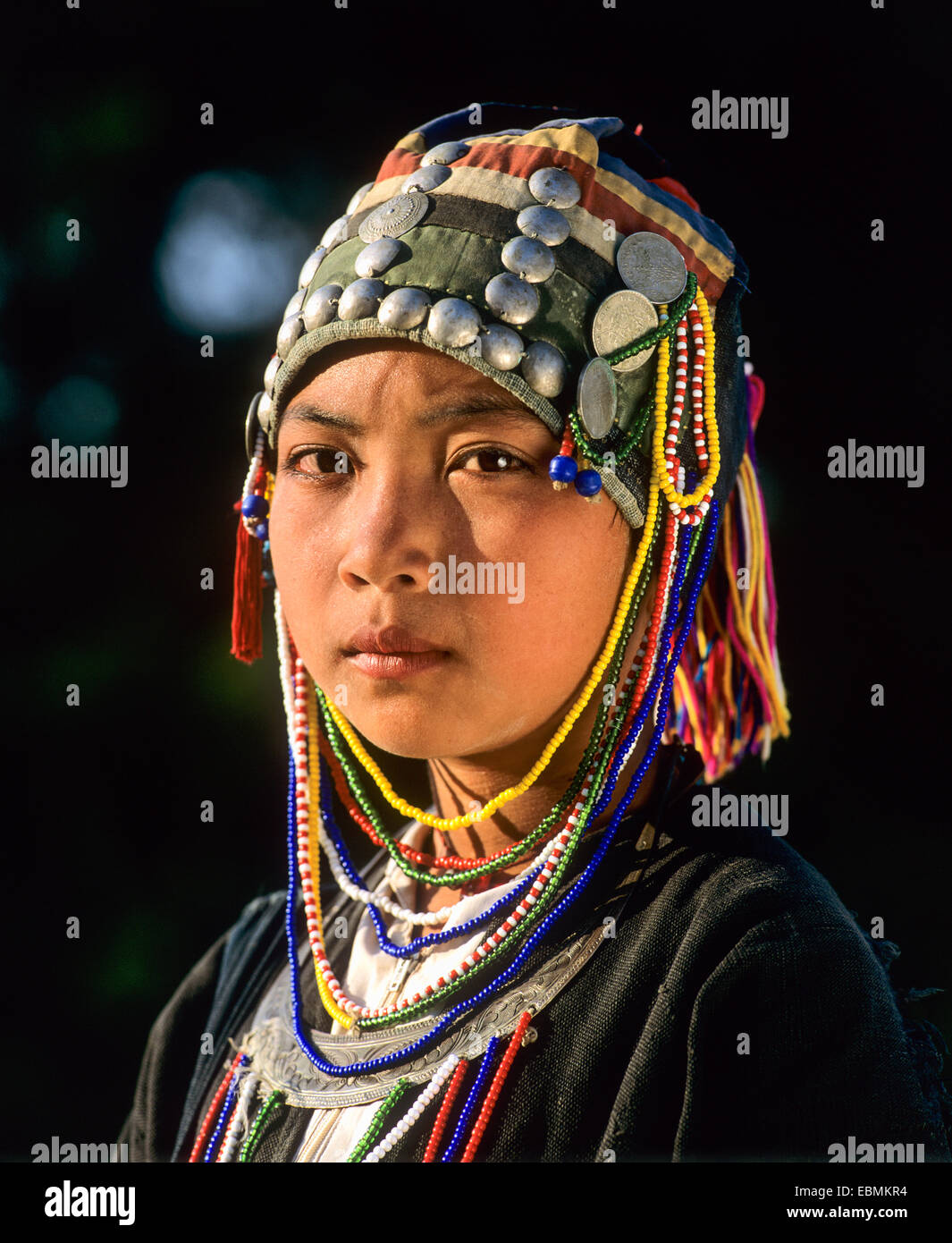 Akha girl with traditional clothing and headdress, portrait, Chiang Rai ...