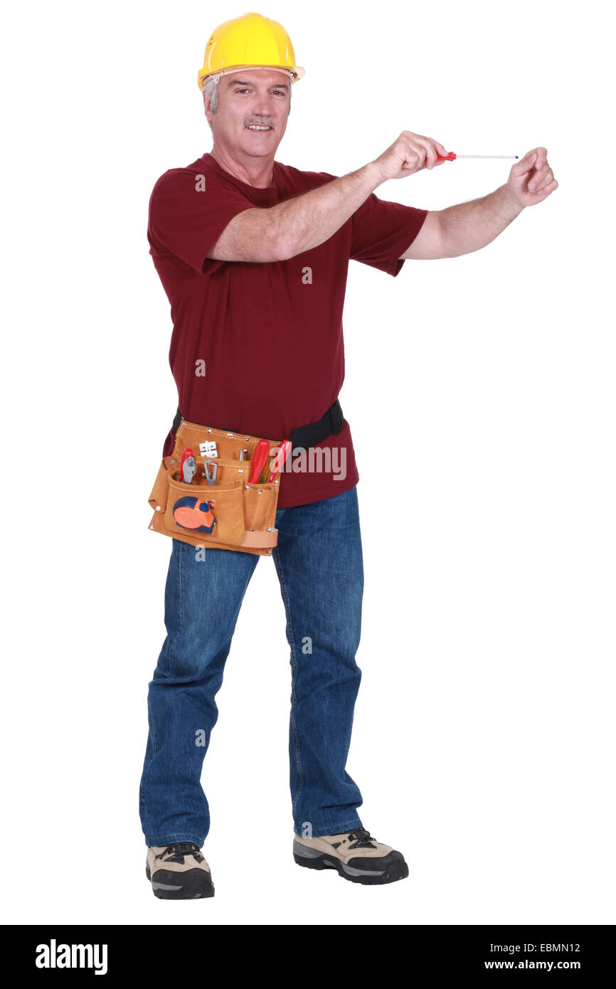 Construction worker using a screwdriver in empty copyspace Stock Photo ...