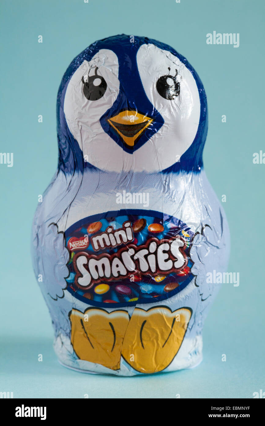 Nestlé mini Smarties Easter penguin chocolate isolated on pale blue ...