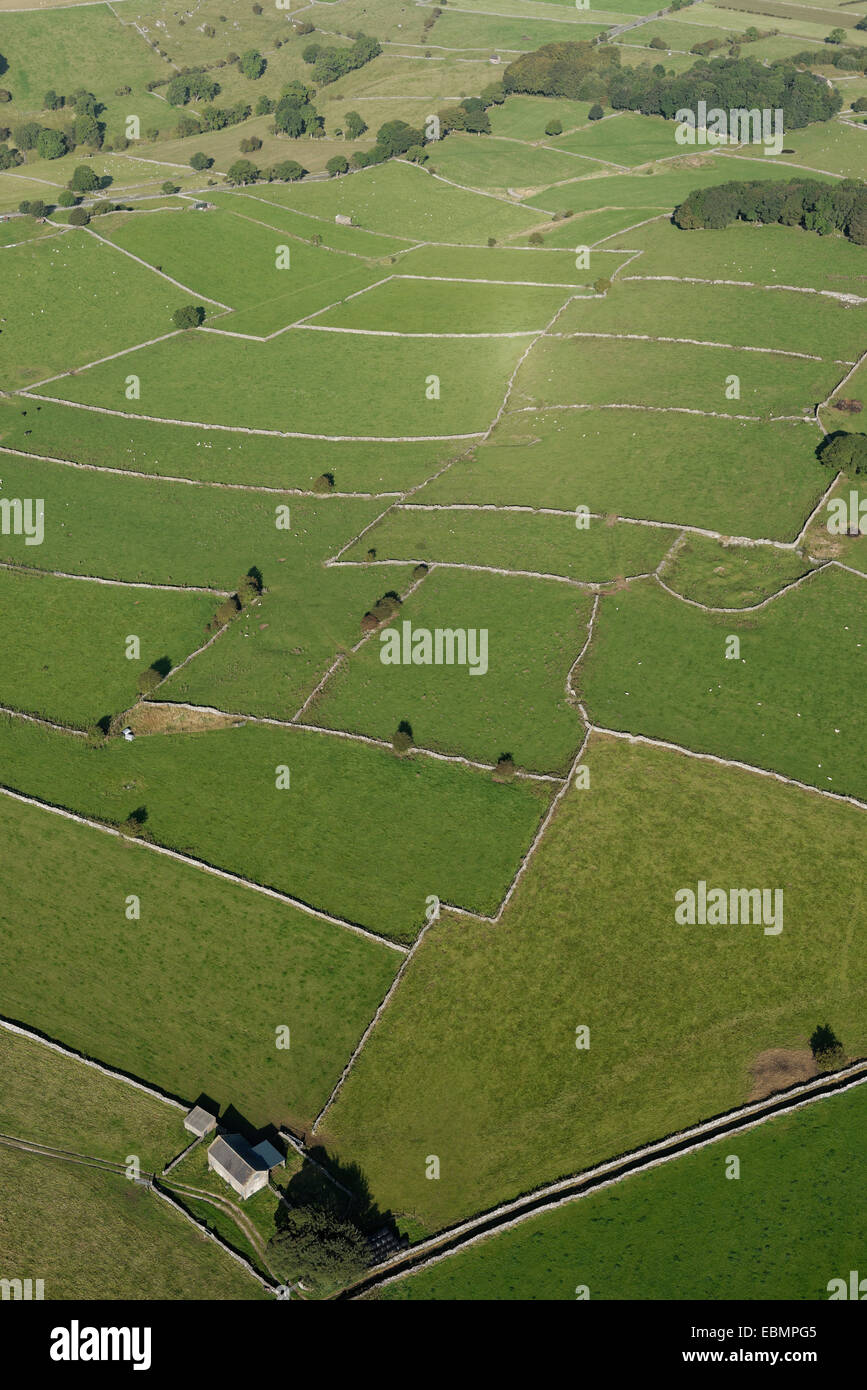 An aerial view of dry stone walls dividing fields in the Peak District ...