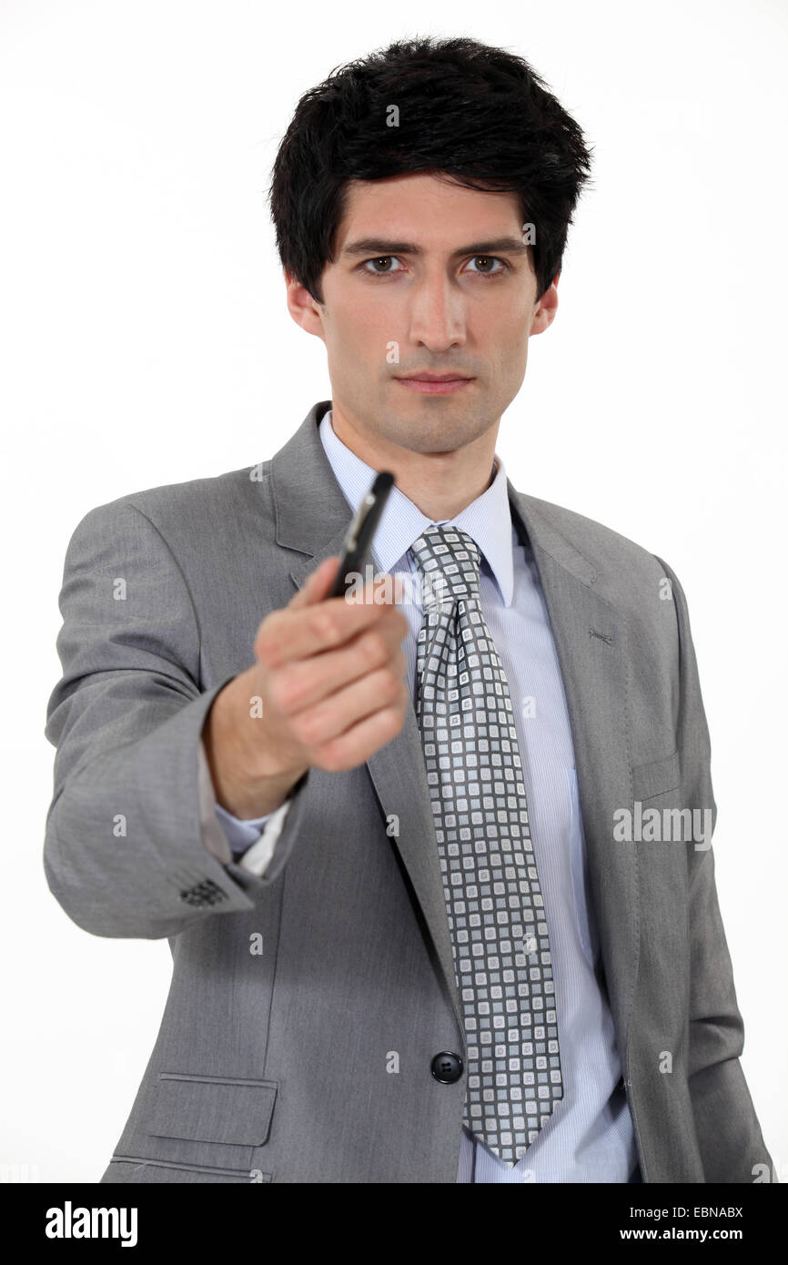 Businessman offering pen Stock Photo - Alamy