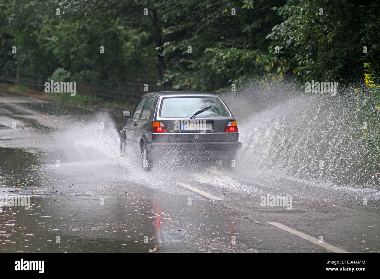 road traffic on flooded road in heavy rain, Germany Stock Photo - Alamy