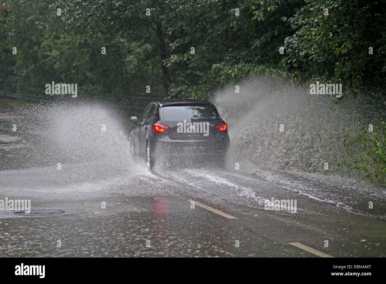 road traffic on flooded road in heavy rain, Germany Stock Photo - Alamy