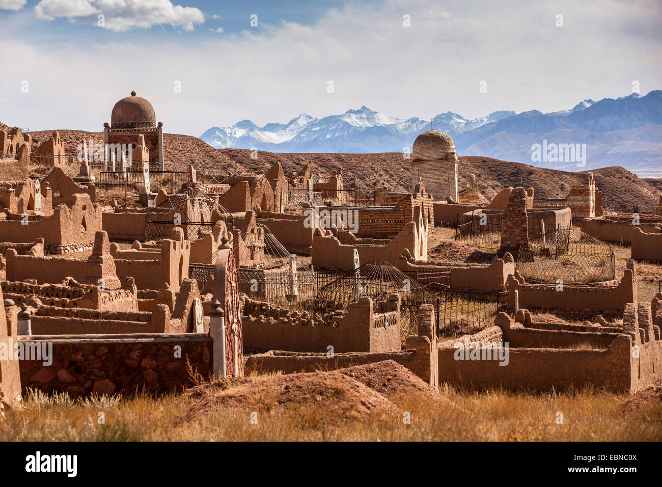 traditional graves made of clay bricks on Islamic cemetery, Kyrgyzstan ...