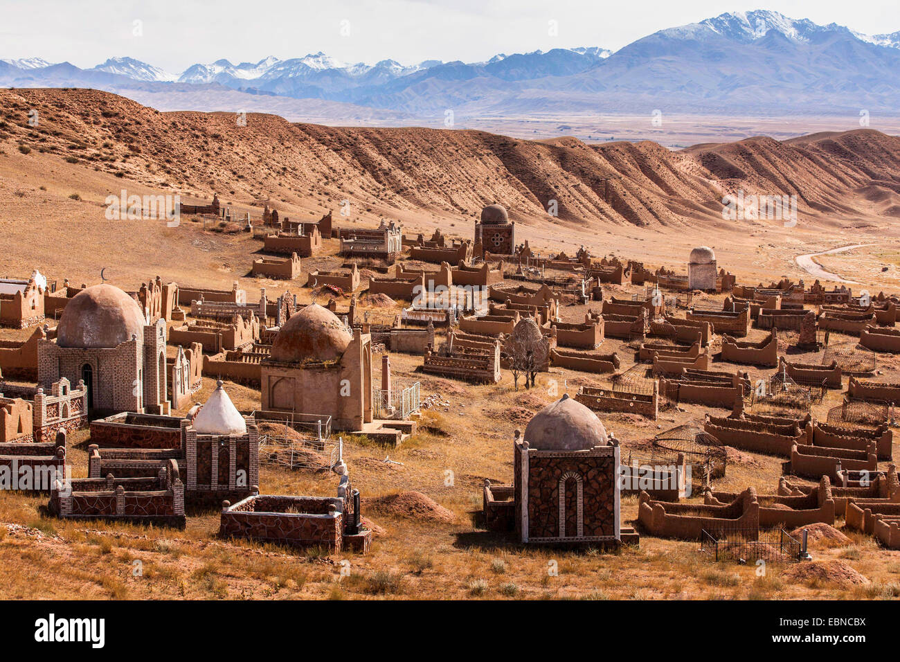traditional graves made of clay bricks on Islamic cemetery, Kyrgyzstan ...