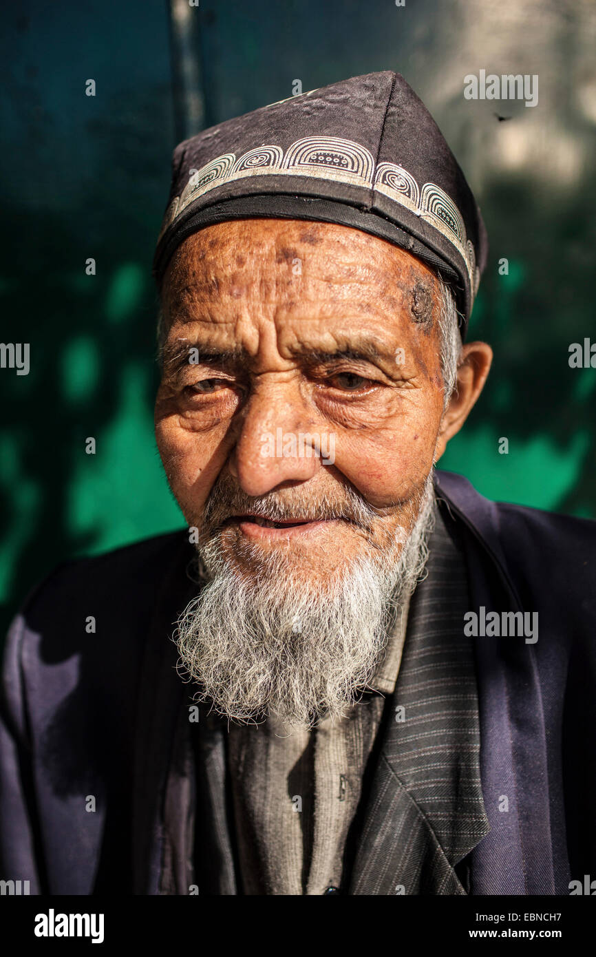 old man with beard and melanoma with typical headgear of the Uzbek ...