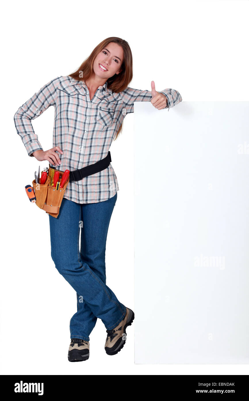 Female construction worker with a blank board Stock Photo - Alamy