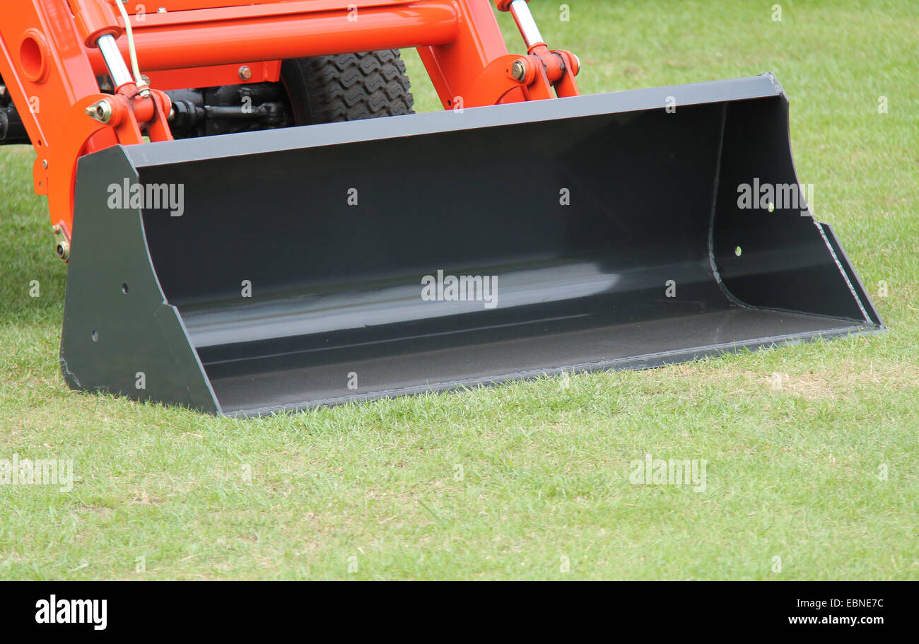 A Wide Bucket on an Orange Mechanical Excavator Stock Photo - Alamy
