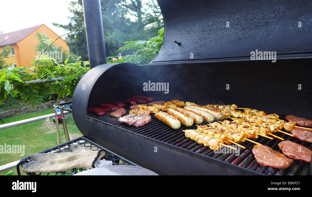 grill meat in a Barbecue-Smoker Stock Photo - Alamy