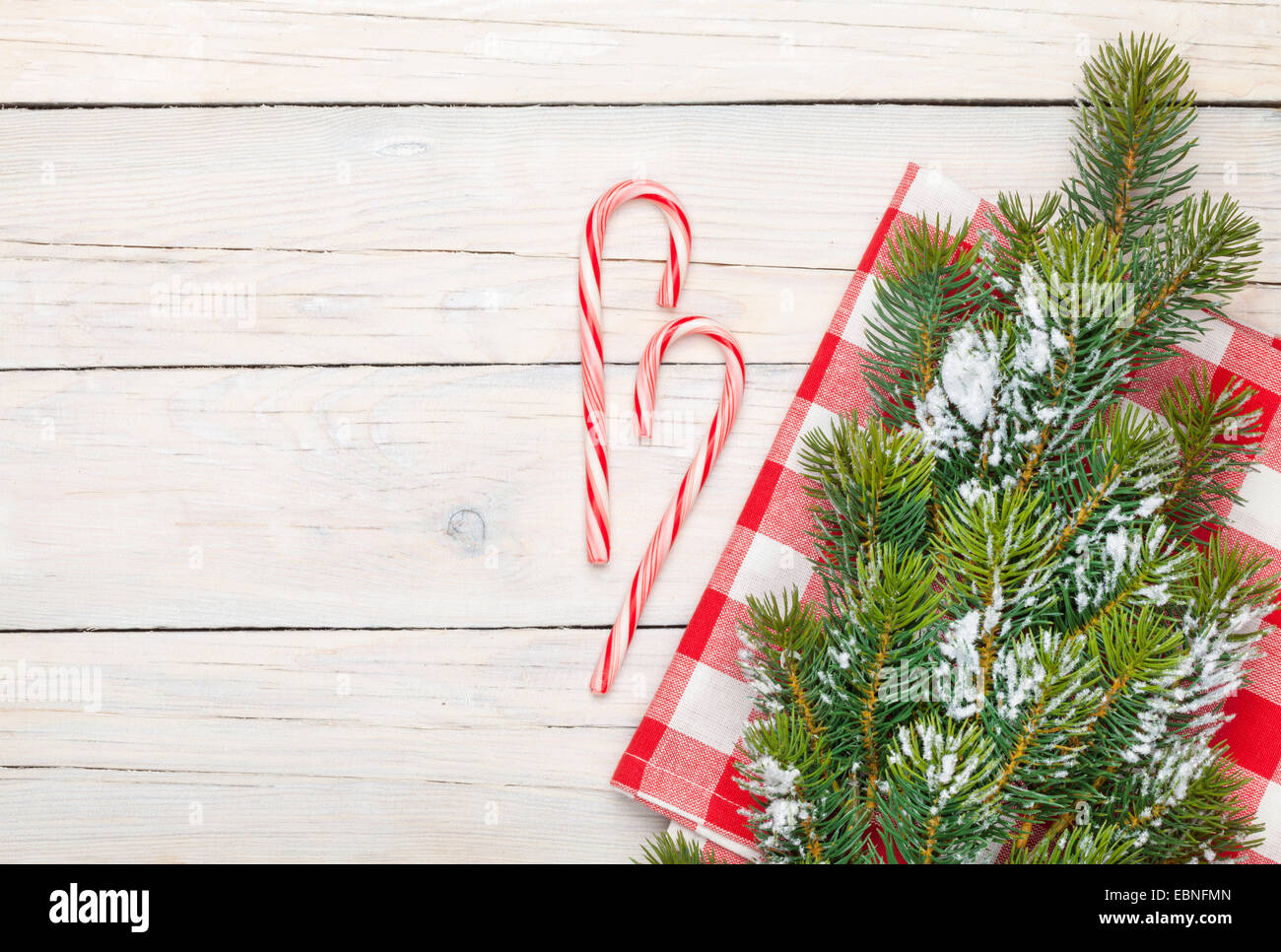 Christmas background with candy cane and snow fir tree. View from above ...