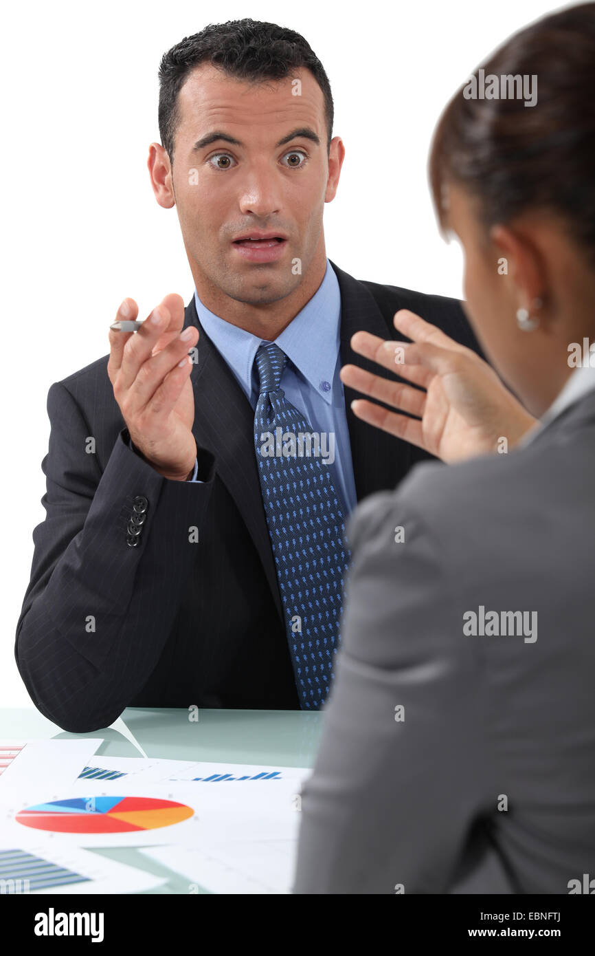 Business couple having a discussion Stock Photo - Alamy
