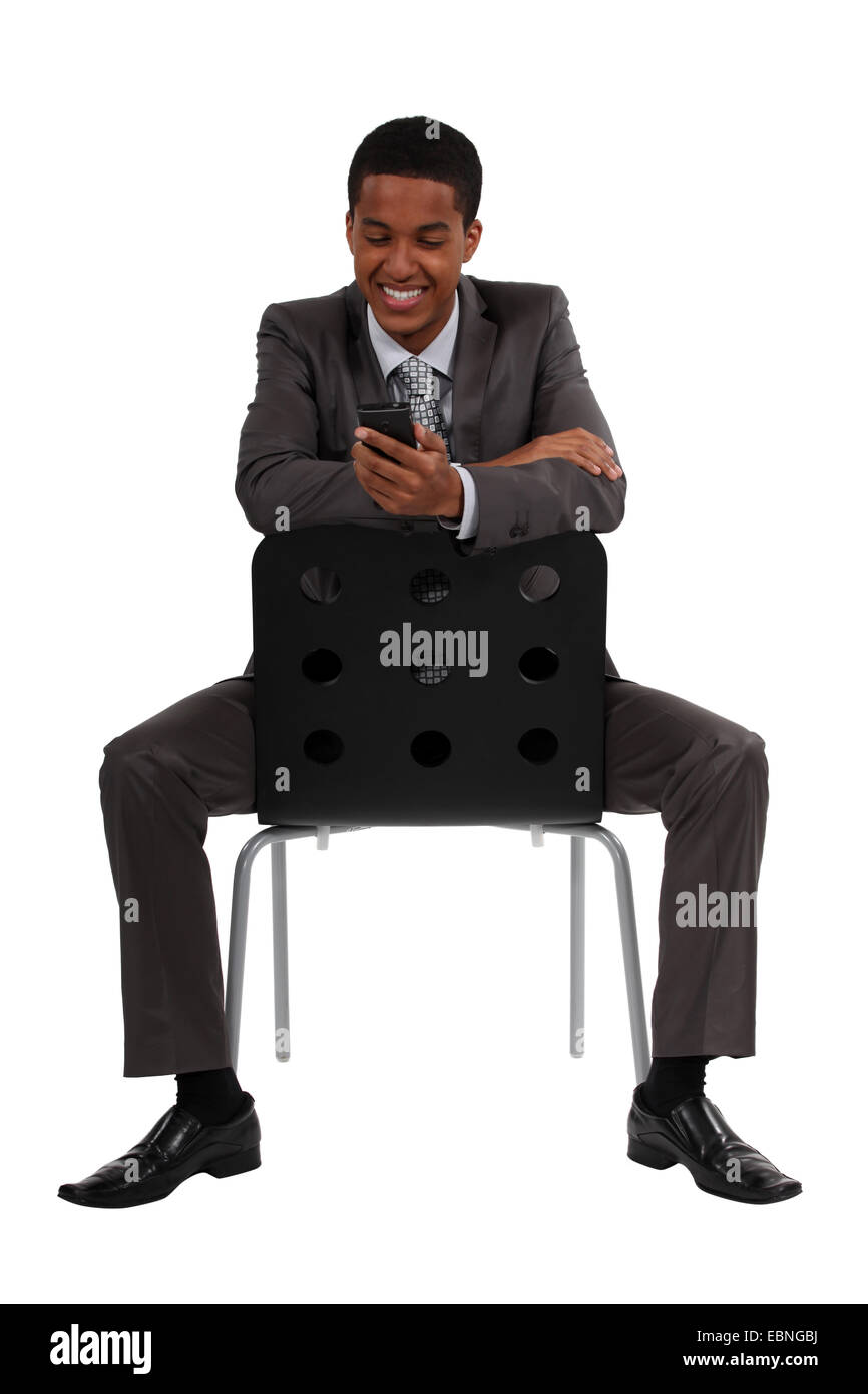 Worker laughing while reading text message Stock Photo - Alamy