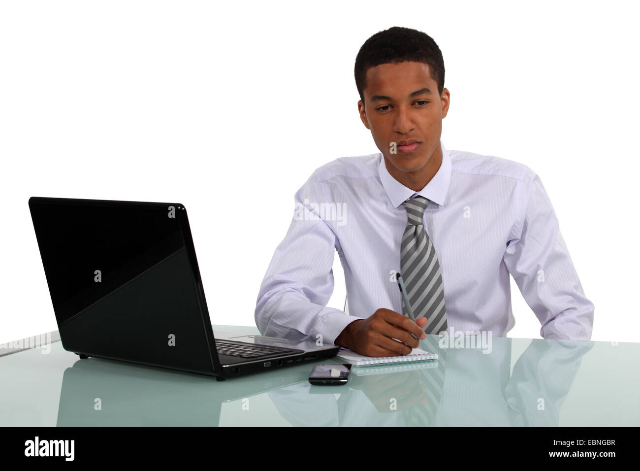 Man sat at desk Stock Photo - Alamy