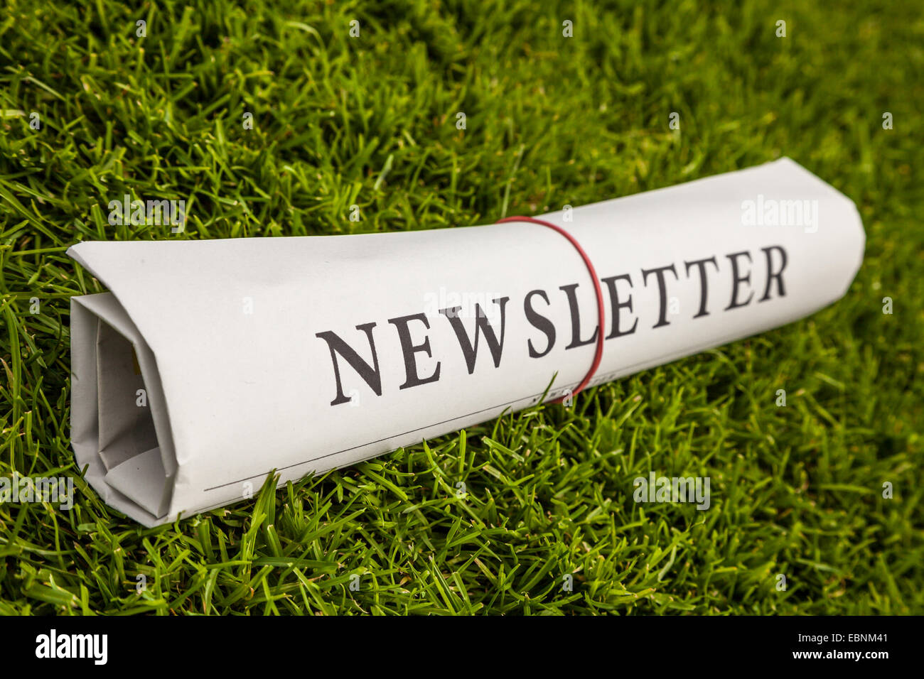 newsletter newspaper on a green meadow Stock Photo - Alamy
