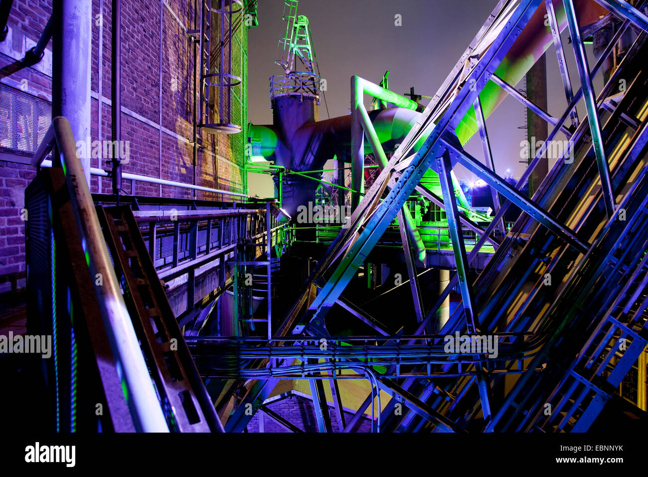 illuminated former steel mill at night, Landschaftspark Duisburg Nord ...