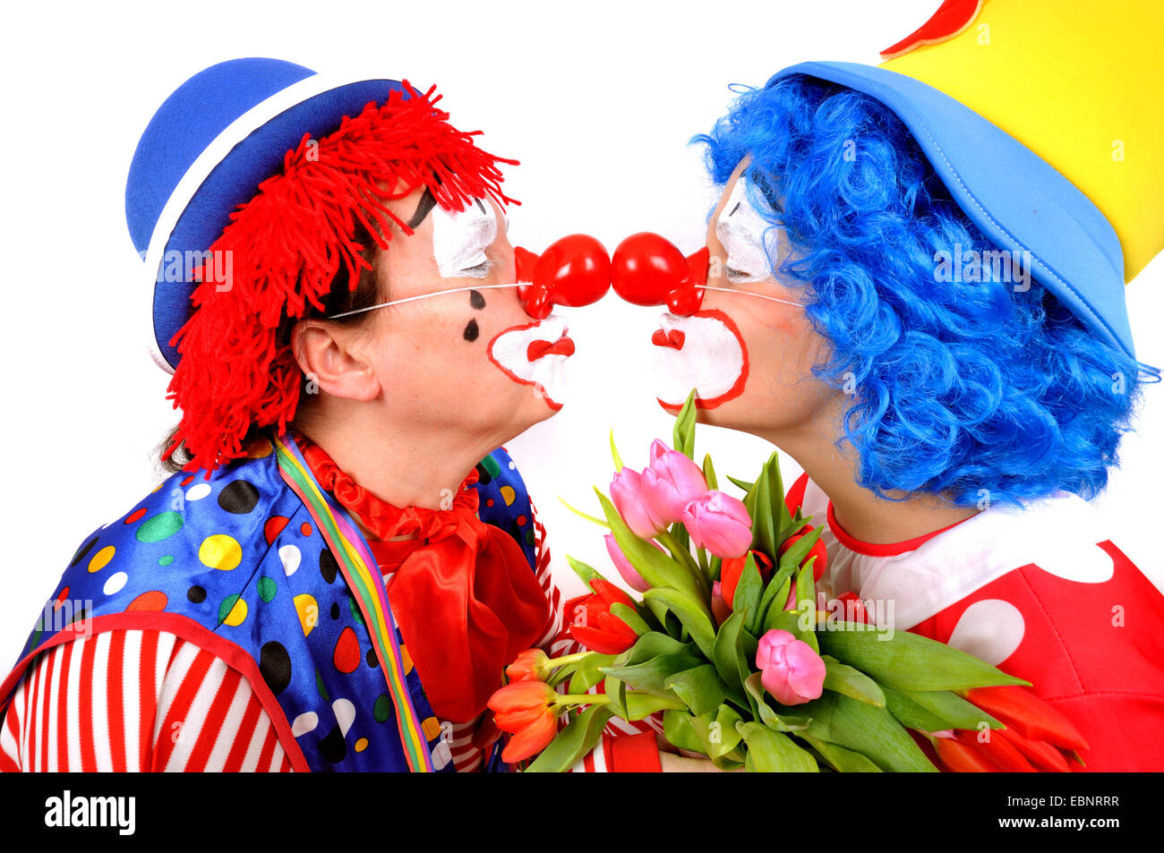 mother with son dressed up as clowns rubbing their red noses and ...
