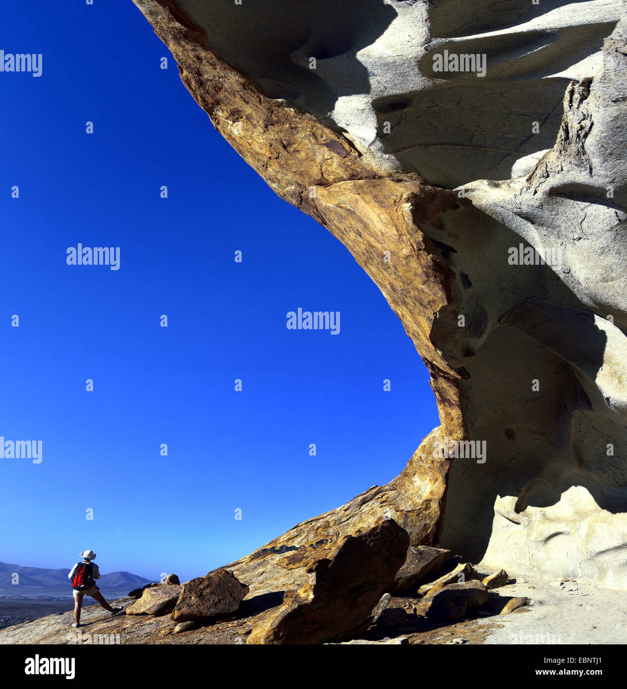 hiker at a cave on the Bloedkoppe mountain, Namibia, Namib Naukluft ...