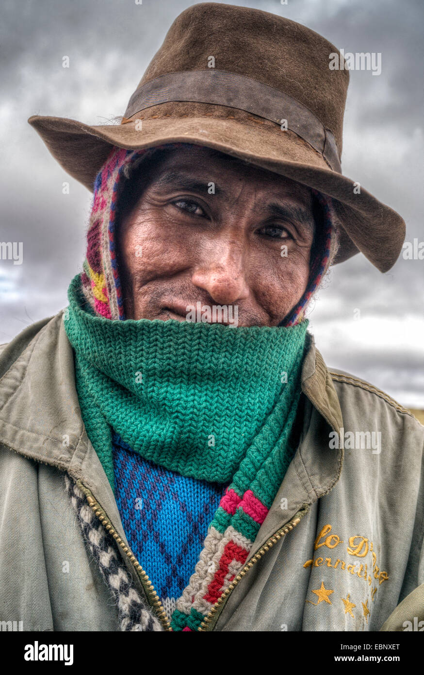 Portrait of middle-aged shepherd in traditional dress in the Andes ...
