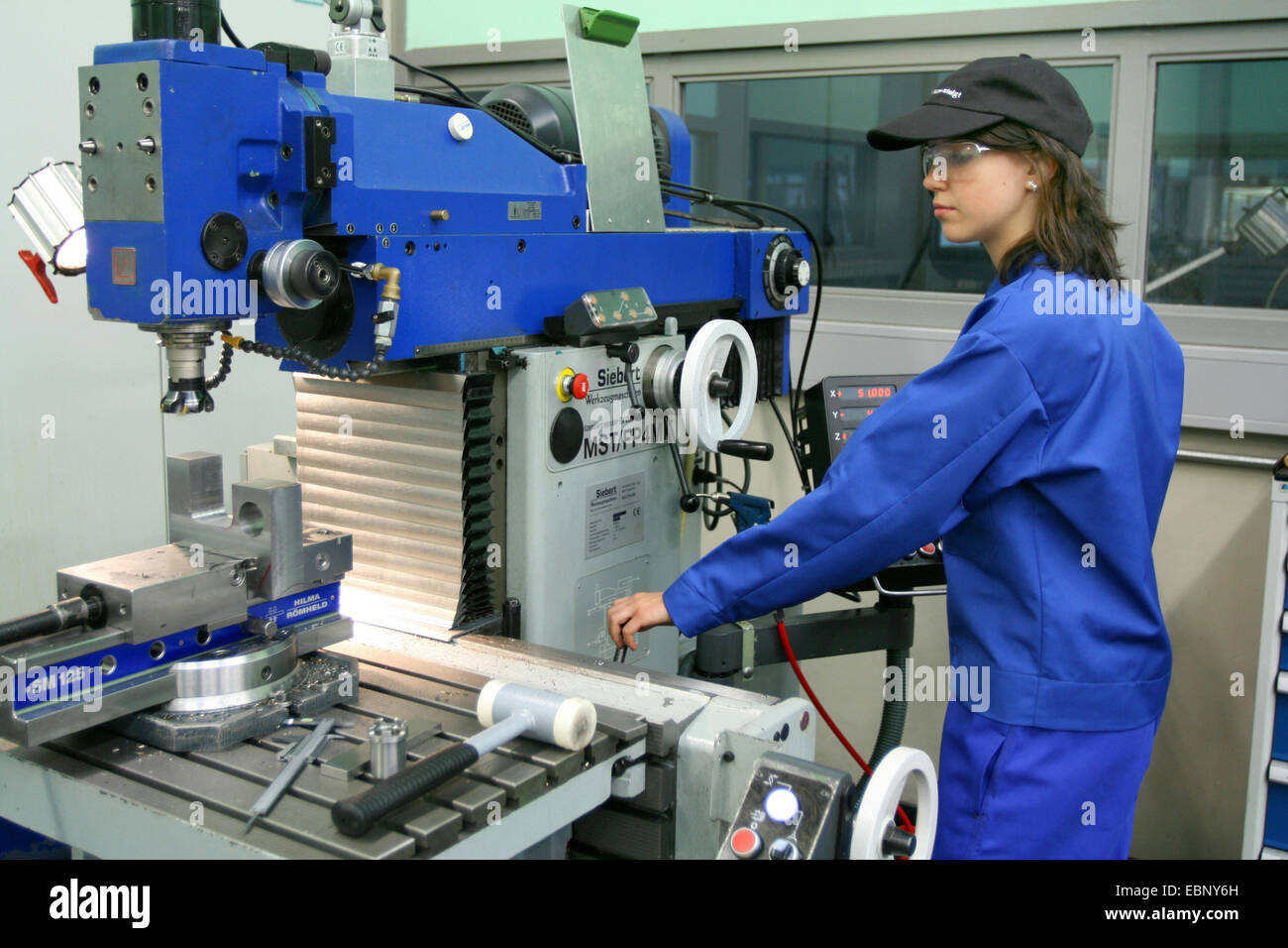 female apprentice working with machines Stock Photo - Alamy