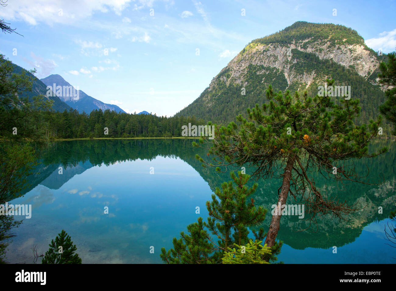 mountain landscape mirroring on lake Plansee, Austria, Tyrol ...