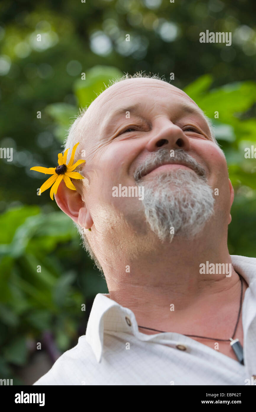 Man flower behind ear hi-res stock photography and images - Alamy