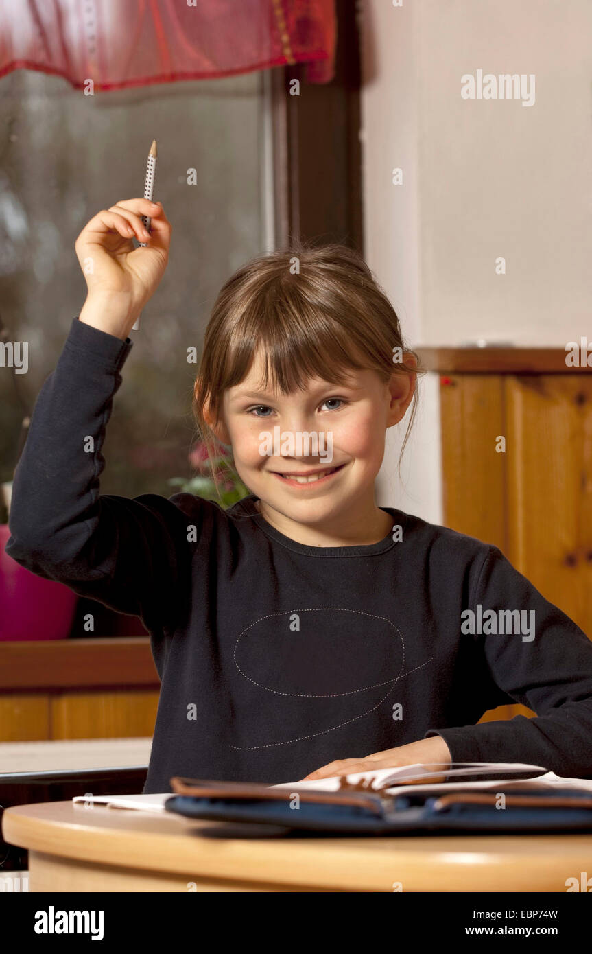 Child putting hand up in class hi-res stock photography and images - Alamy